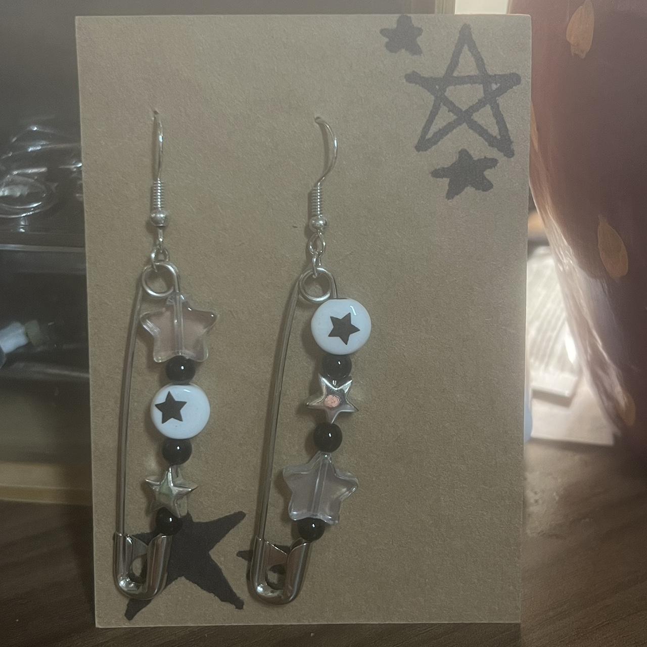 asymmetrical star themed safety pin earrings... - Depop