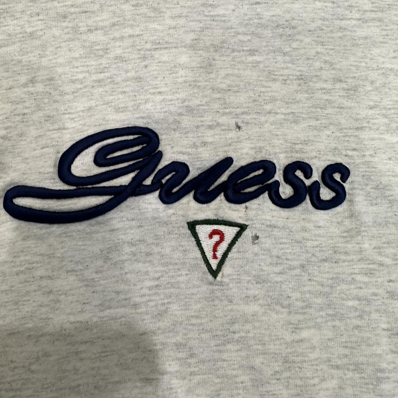 grey Guess t shirt embroidered small rips near... - Depop
