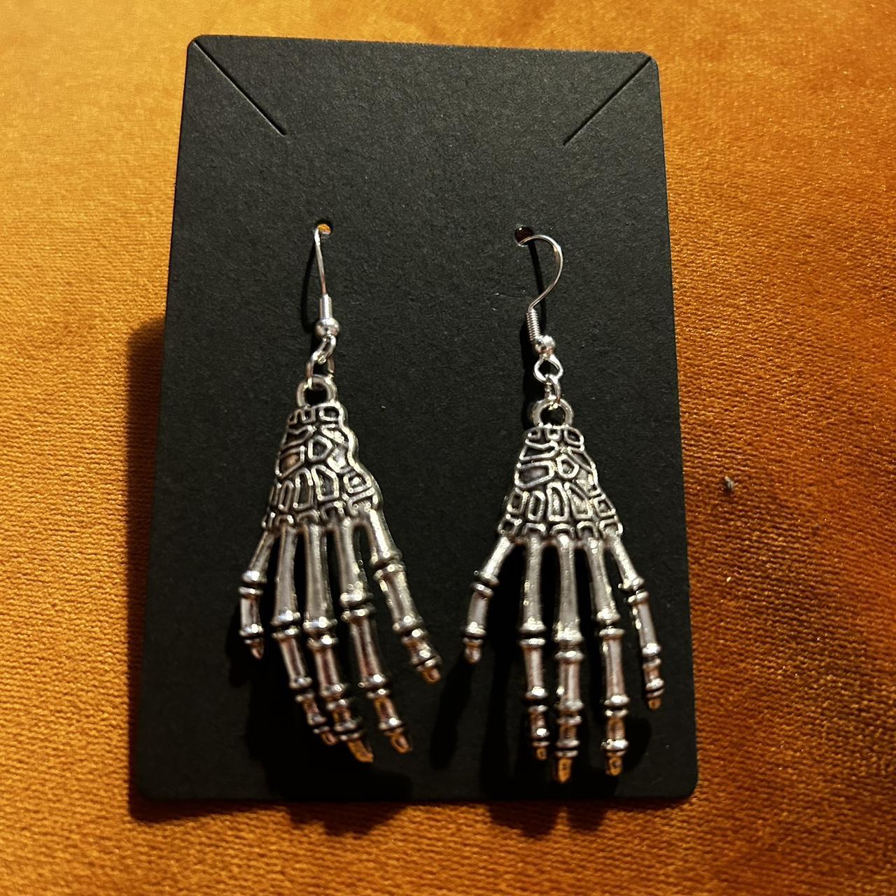 Large skeleton skull bones hands charms dangle... - Depop