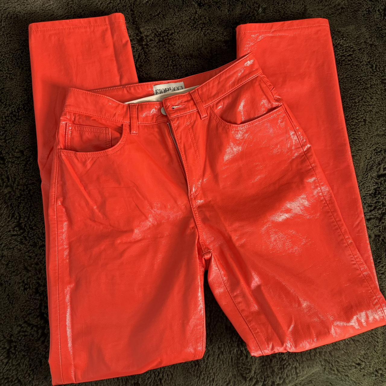 Fiorucci vinyl orange trousers in size 29 (around a... - Depop