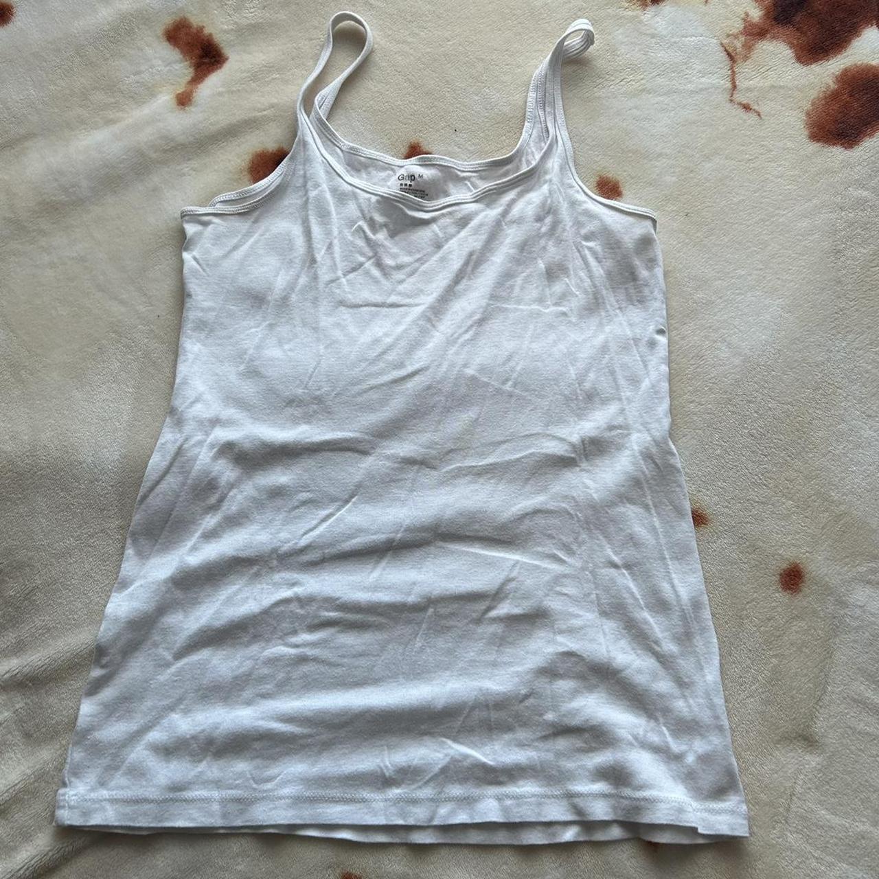 Simple white tank top. It’s very wrinkled. I am... - Depop