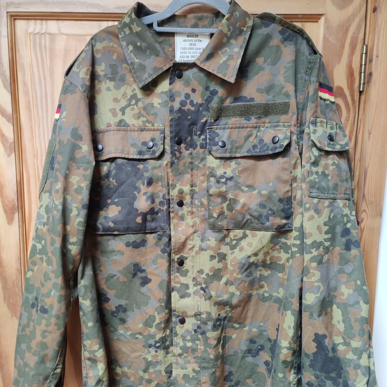 Army jacket adorned with German flags on sleeves.... - Depop