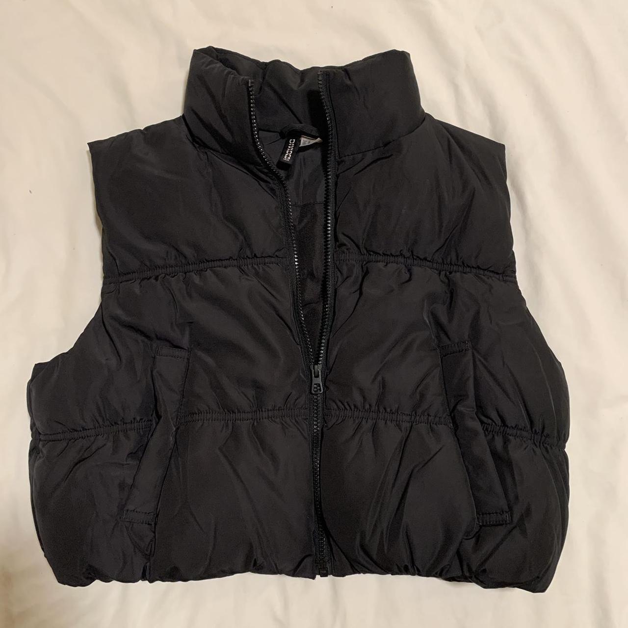 Black cropped puffer vest. Size medium. Worn less... - Depop