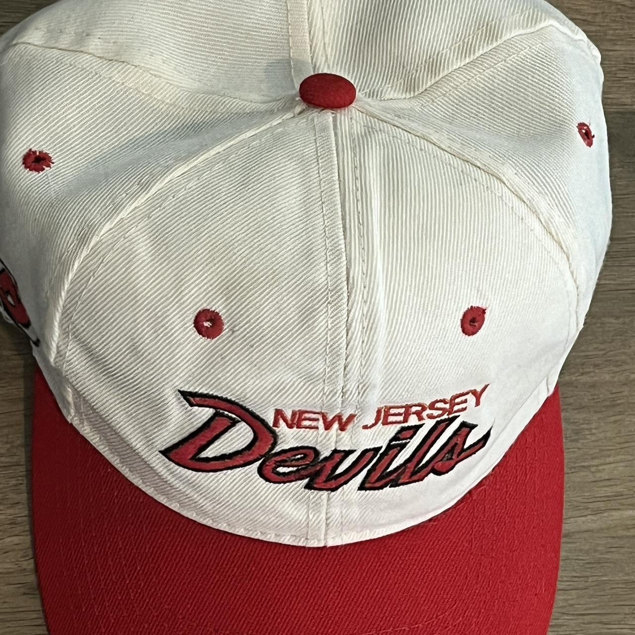 Item - Vintage 90s New Jersey Devils SnapBack Script... - Depop