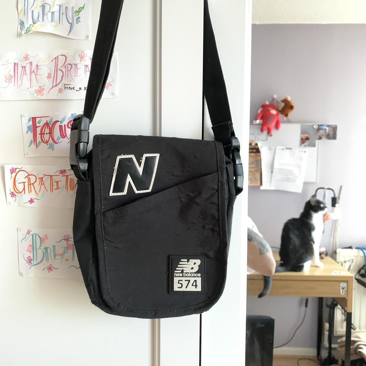 pre loved small new balance cross body bag with five... - Depop