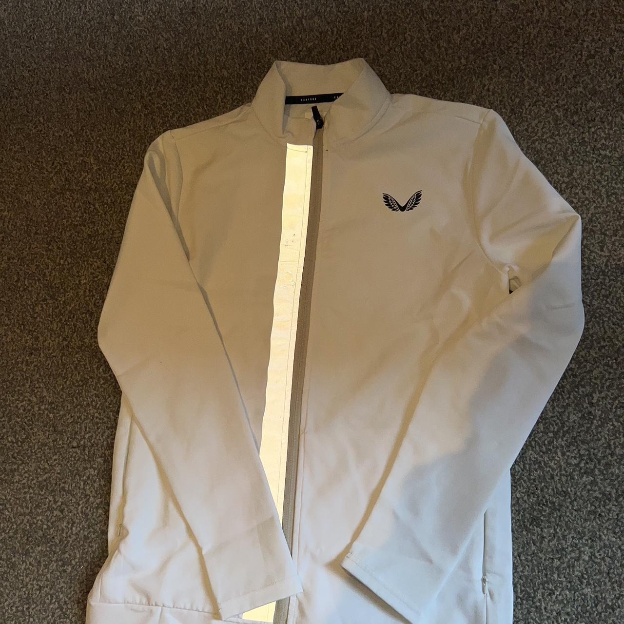 White Castore anthem jacket size small Excellent... - Depop