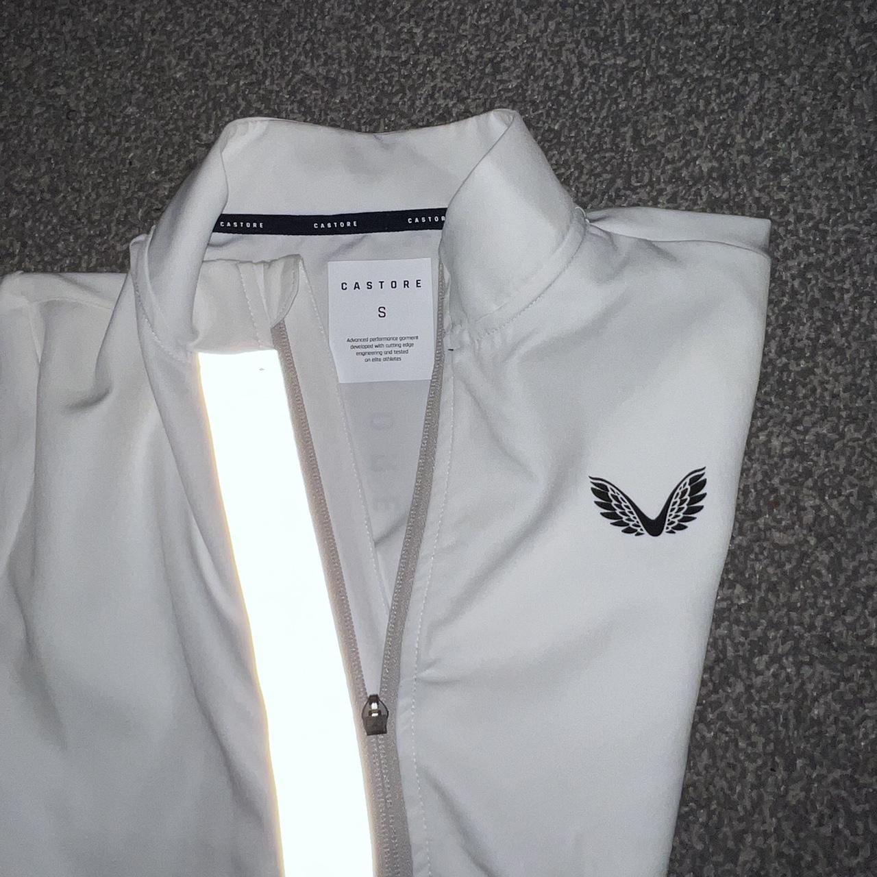 White Castore anthem jacket size small Excellent... - Depop