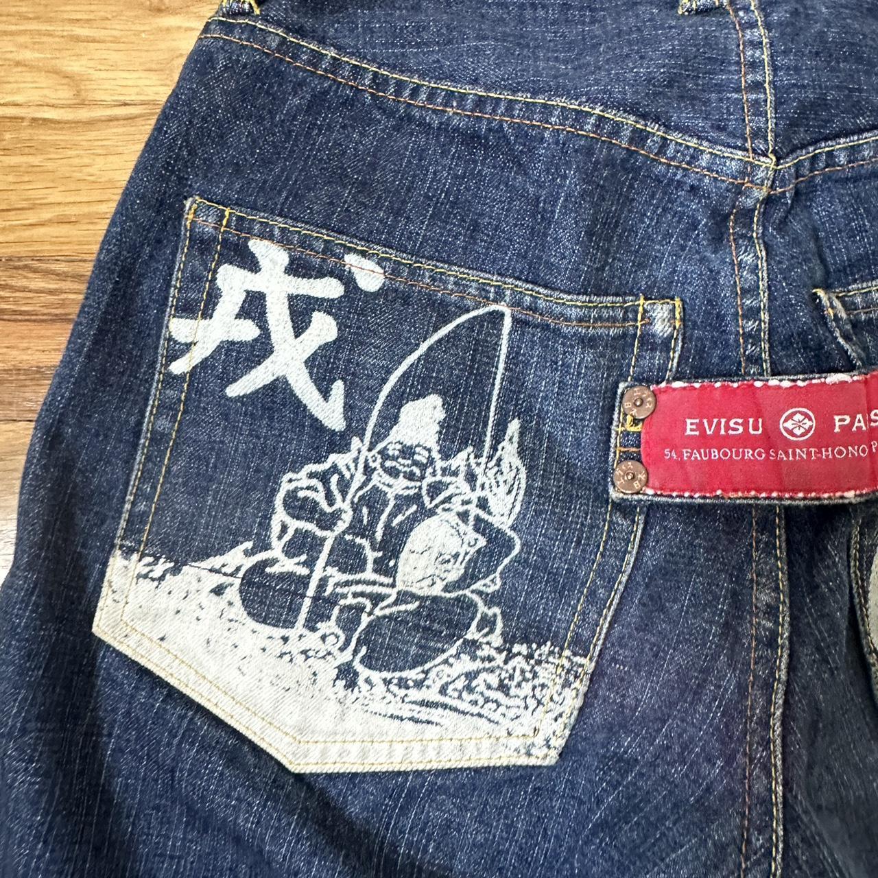 Evisu jeans with a unique design on the back pocket... - Depop