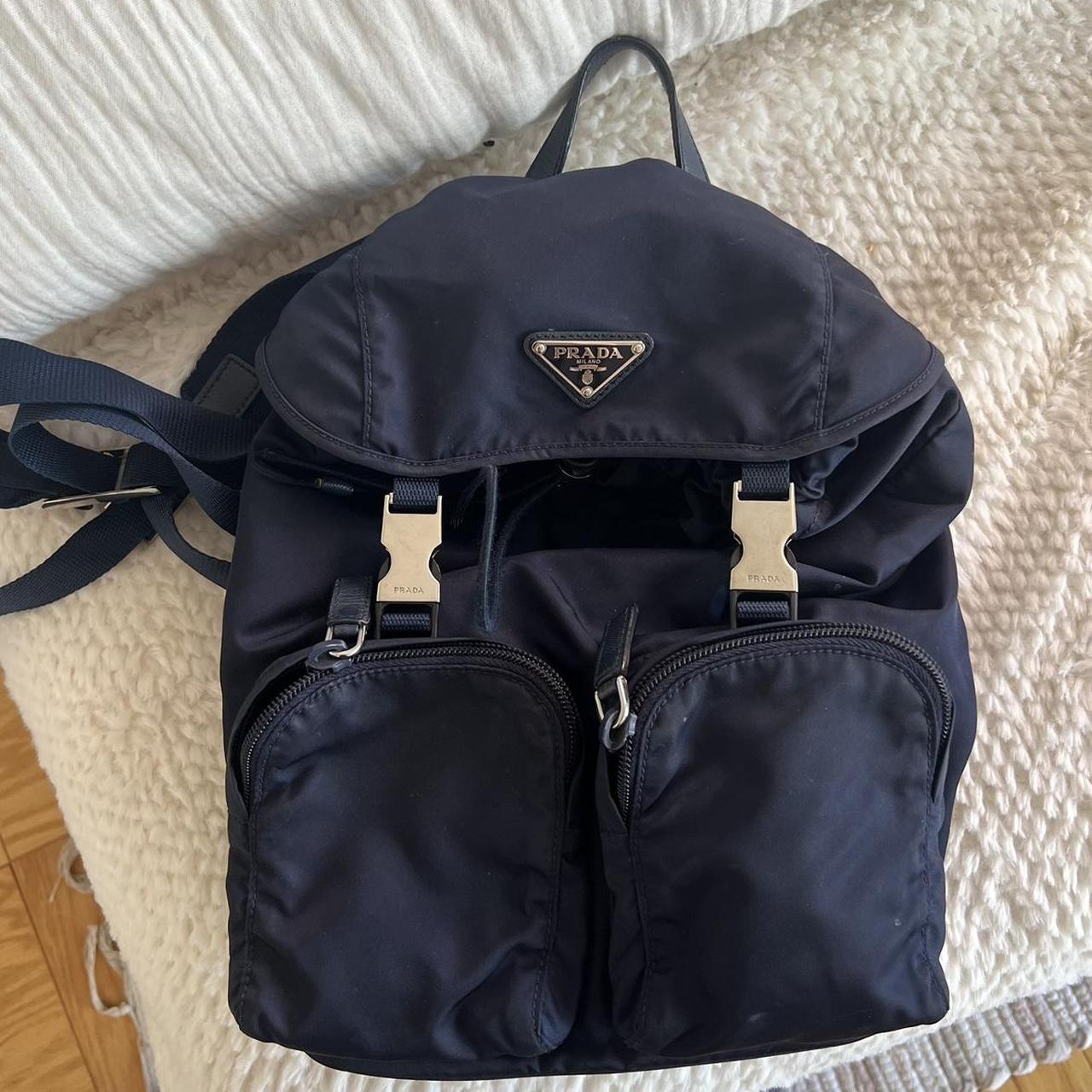 prada backpack! mini navy blue color. minor flaws... - Depop