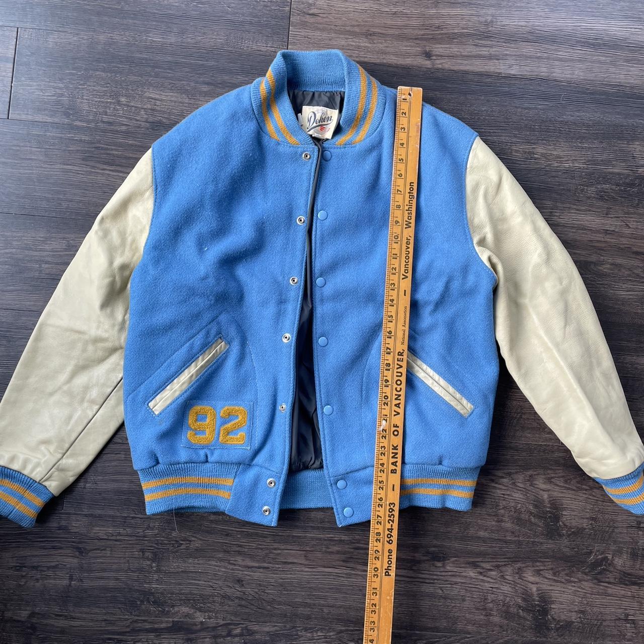 Vintage varsity jacket ucla 1992 small tear in the... - Depop