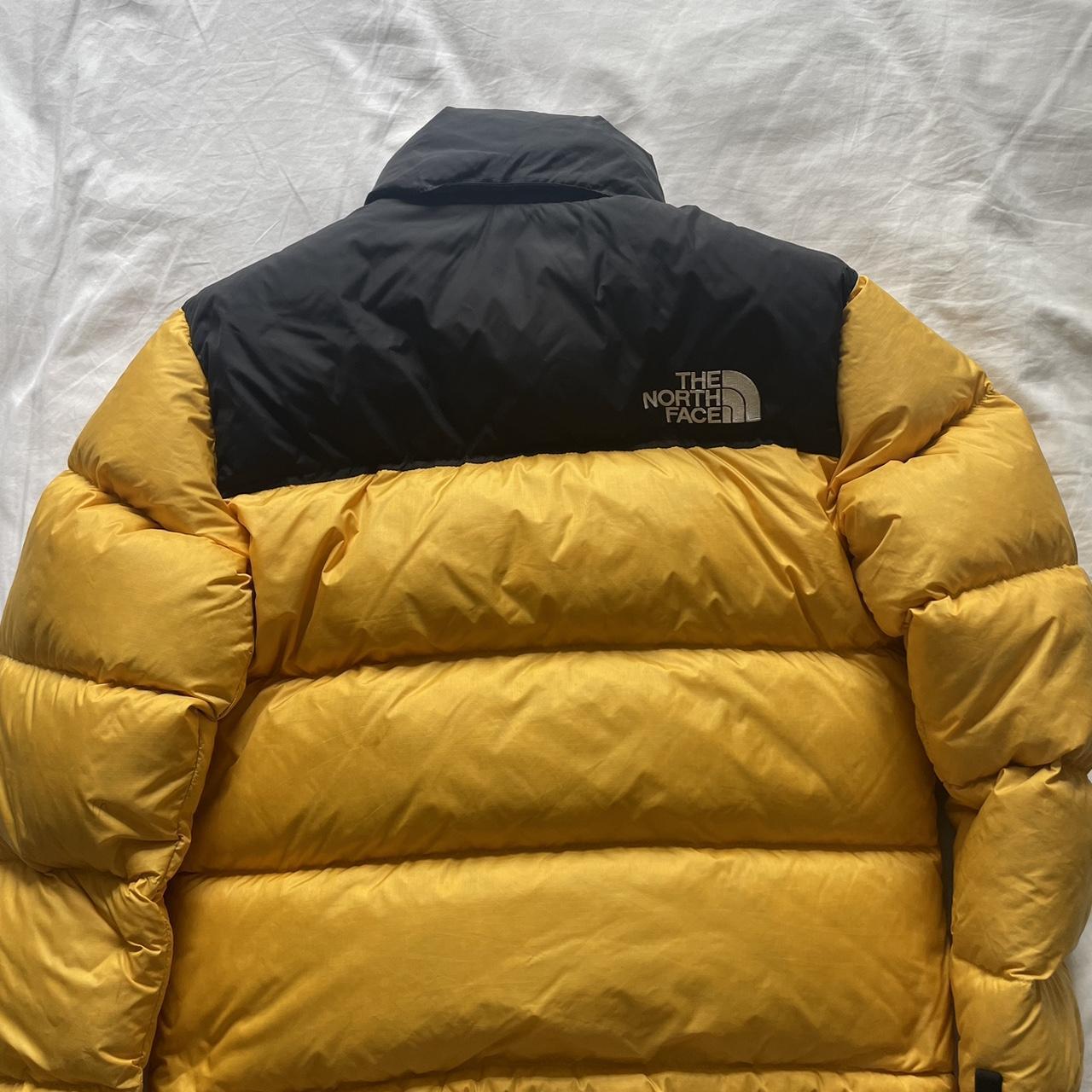 The North Face women’s yellow puffer jacket. Size... - Depop