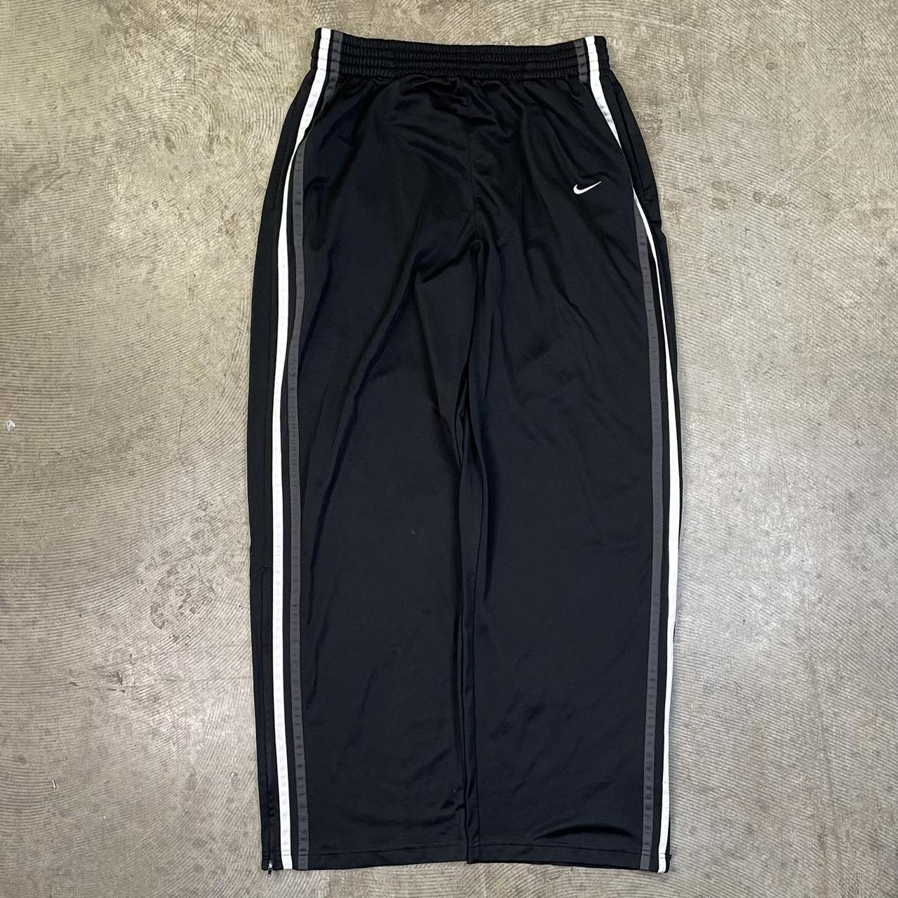Nike baggy tracksuit bottoms joggers black size... - Depop