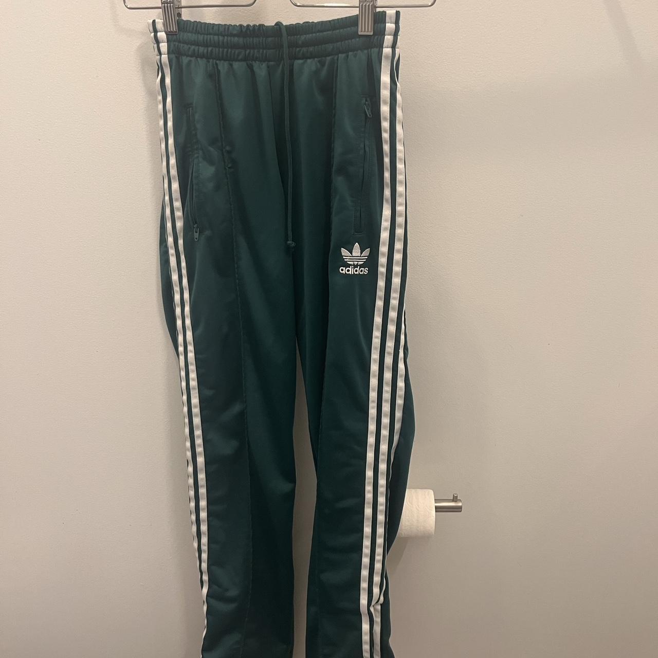 Adidas originals dark green track pants with zip at... - Depop