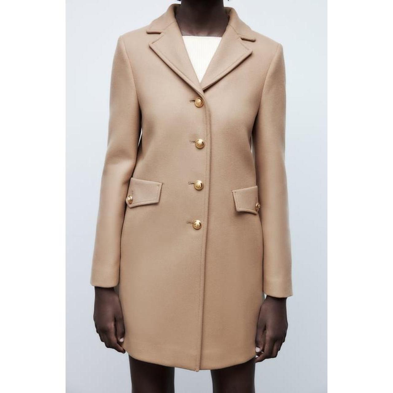 Straight fit coat made of a wool blend. Lapel collar... - Depop