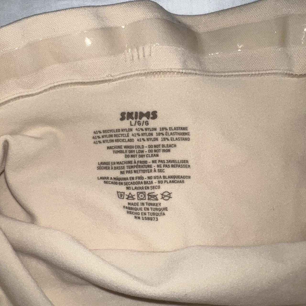 Skims cream and white seamless leggings Left leg... - Depop