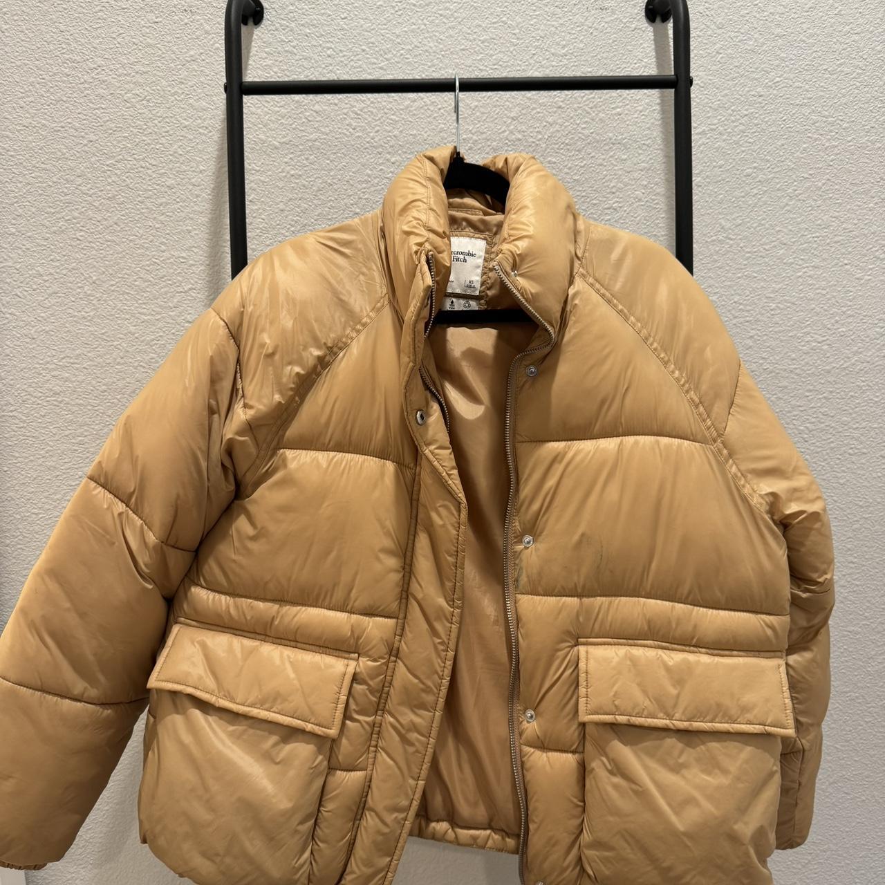 Caramel puffer jacket! Has some ink stains but still... - Depop