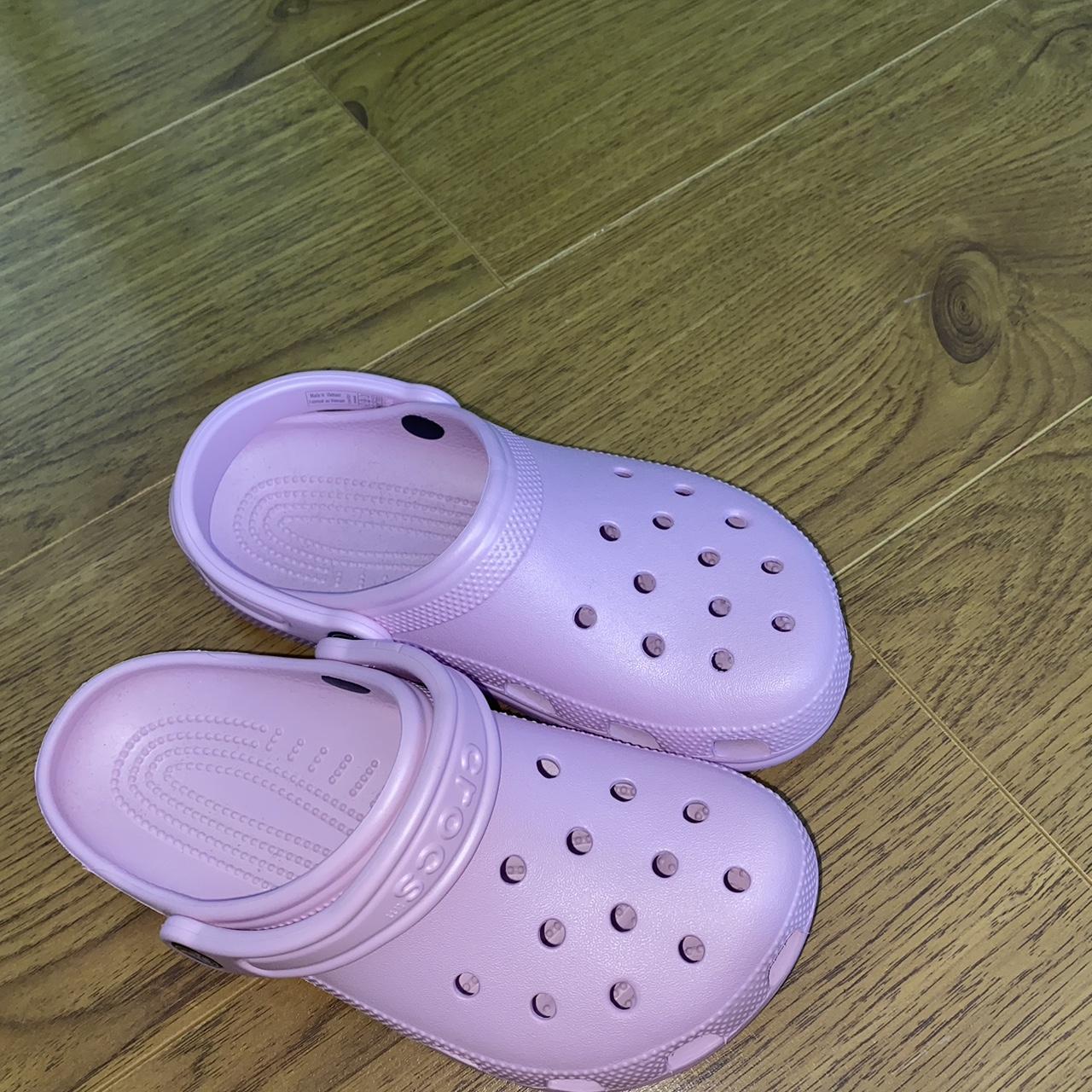 Crocs Women's Pink Flipflops | Depop