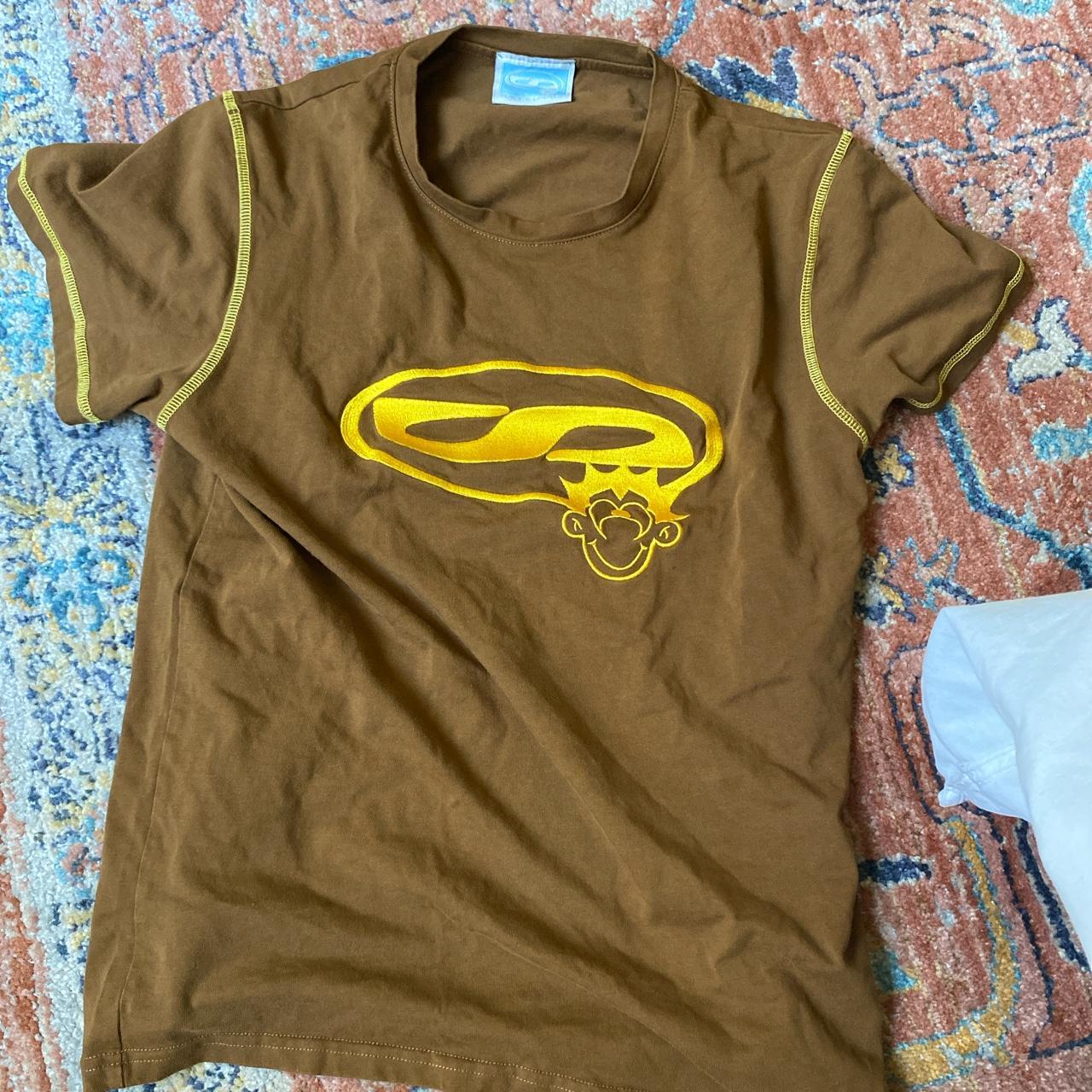 Atticus torre brown t shirt w yellow stitching on... - Depop