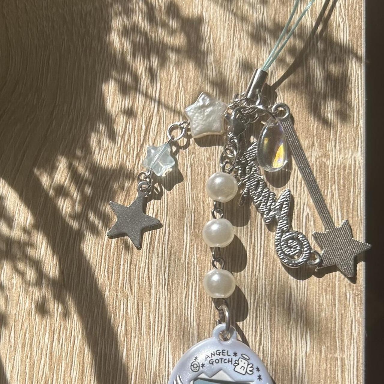 angel tamagotchi keychain with cute dangles #angel... - Depop
