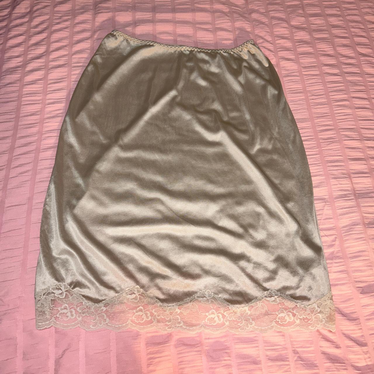 Tanish cream slip with lace detailing at the bottom... - Depop