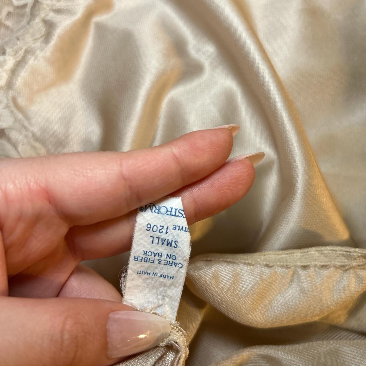 Tanish cream slip with lace detailing at the bottom... - Depop