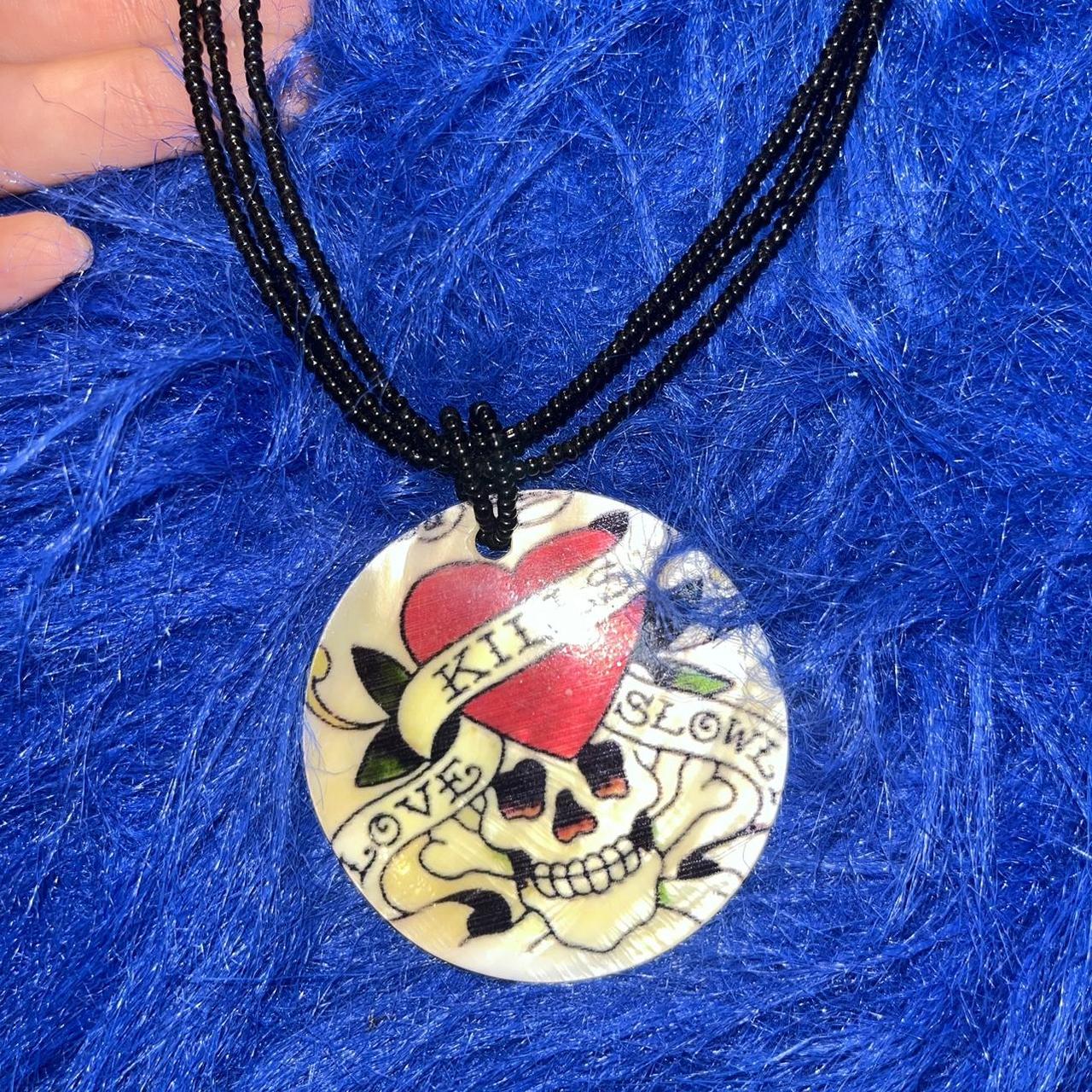 Pearl shell Ed hardy necklace with small black beads... - Depop