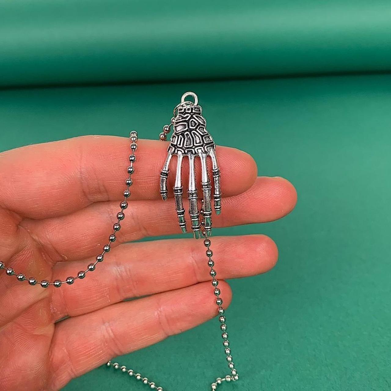 Skeleton hand y2k style punk goth necklace. 24 total... - Depop