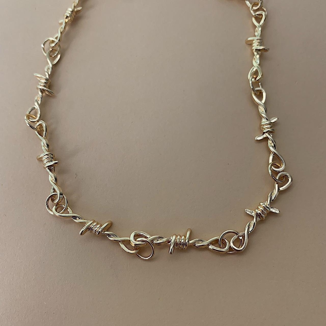 Y2k gold barbwire opium punk style chocker necklace.... - Depop