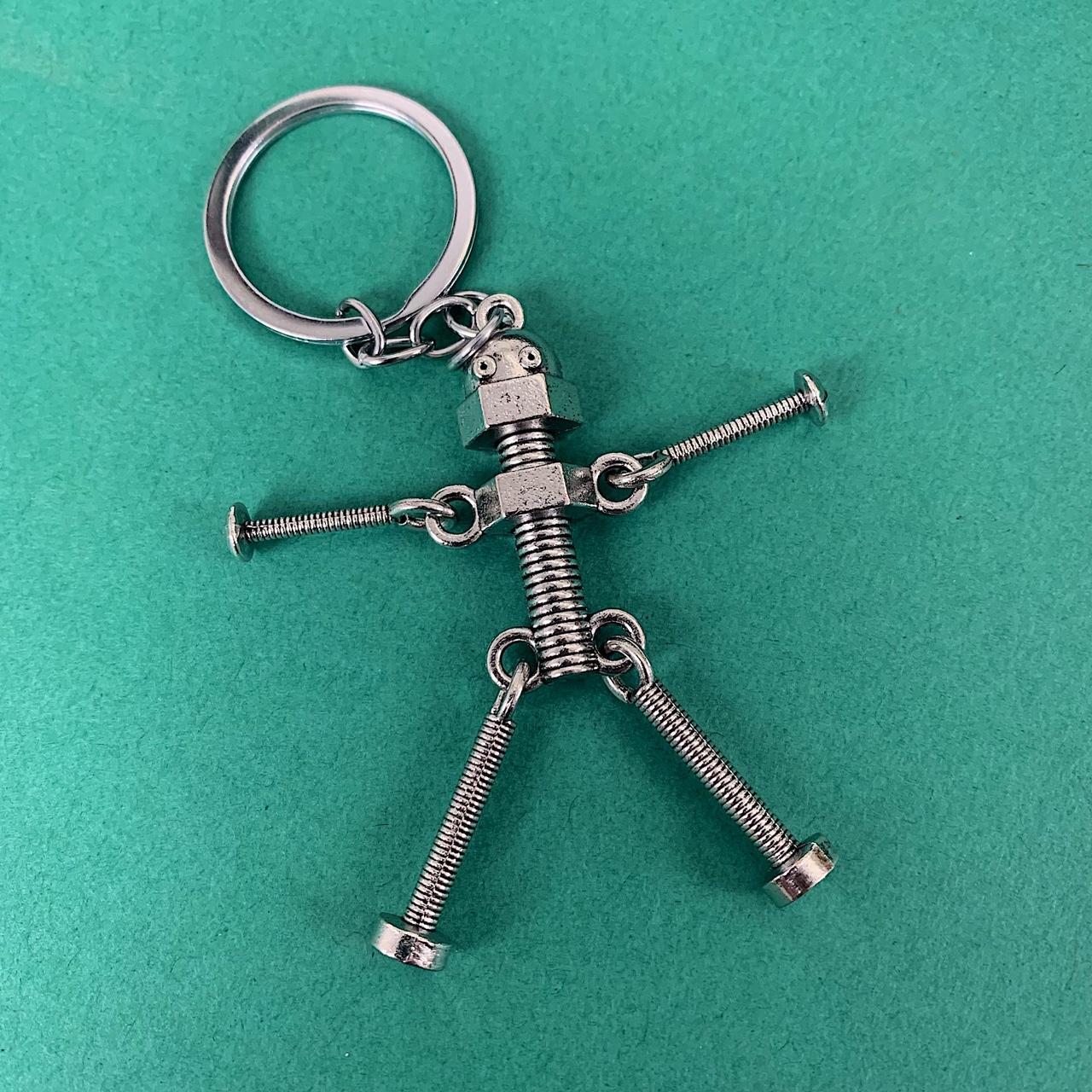 Y2k vintage 2000s style metal robot keychain. Comes... | Depop