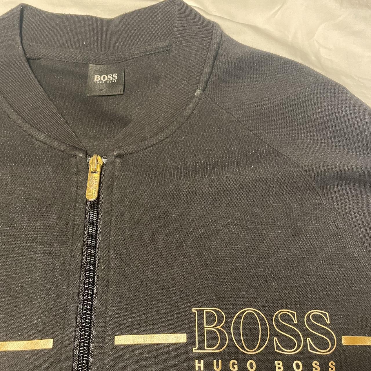 Hugo Boss AJ Track top Black/gold - Depop