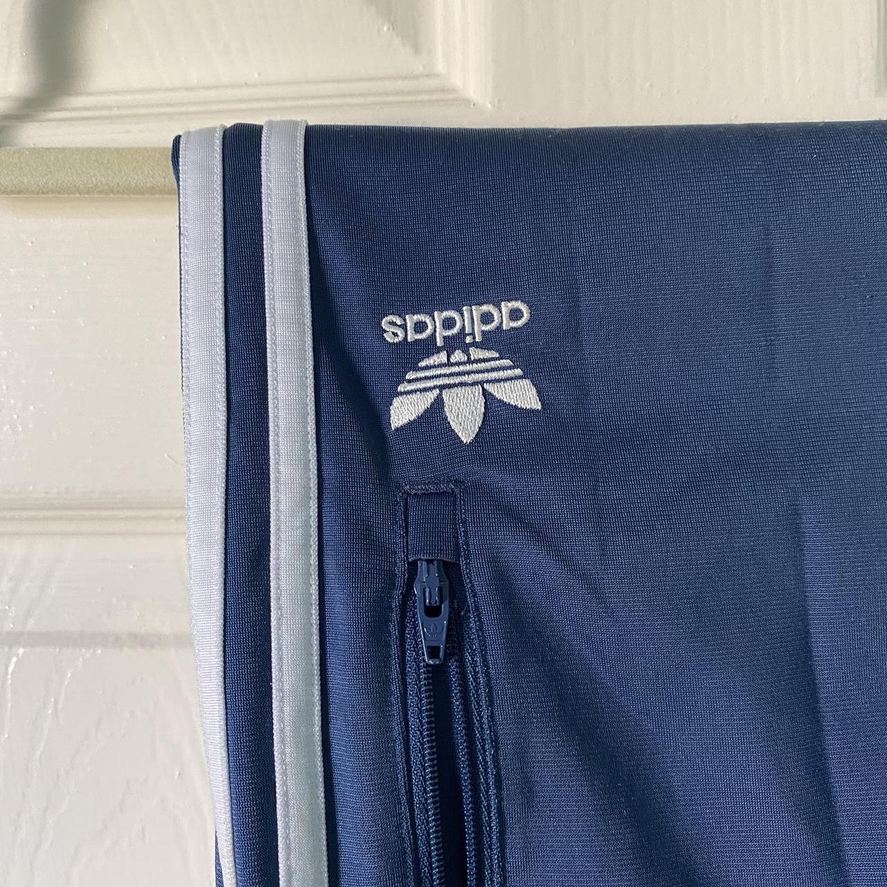 Blue and white adidas tracksuit bottoms size medium.... - Depop