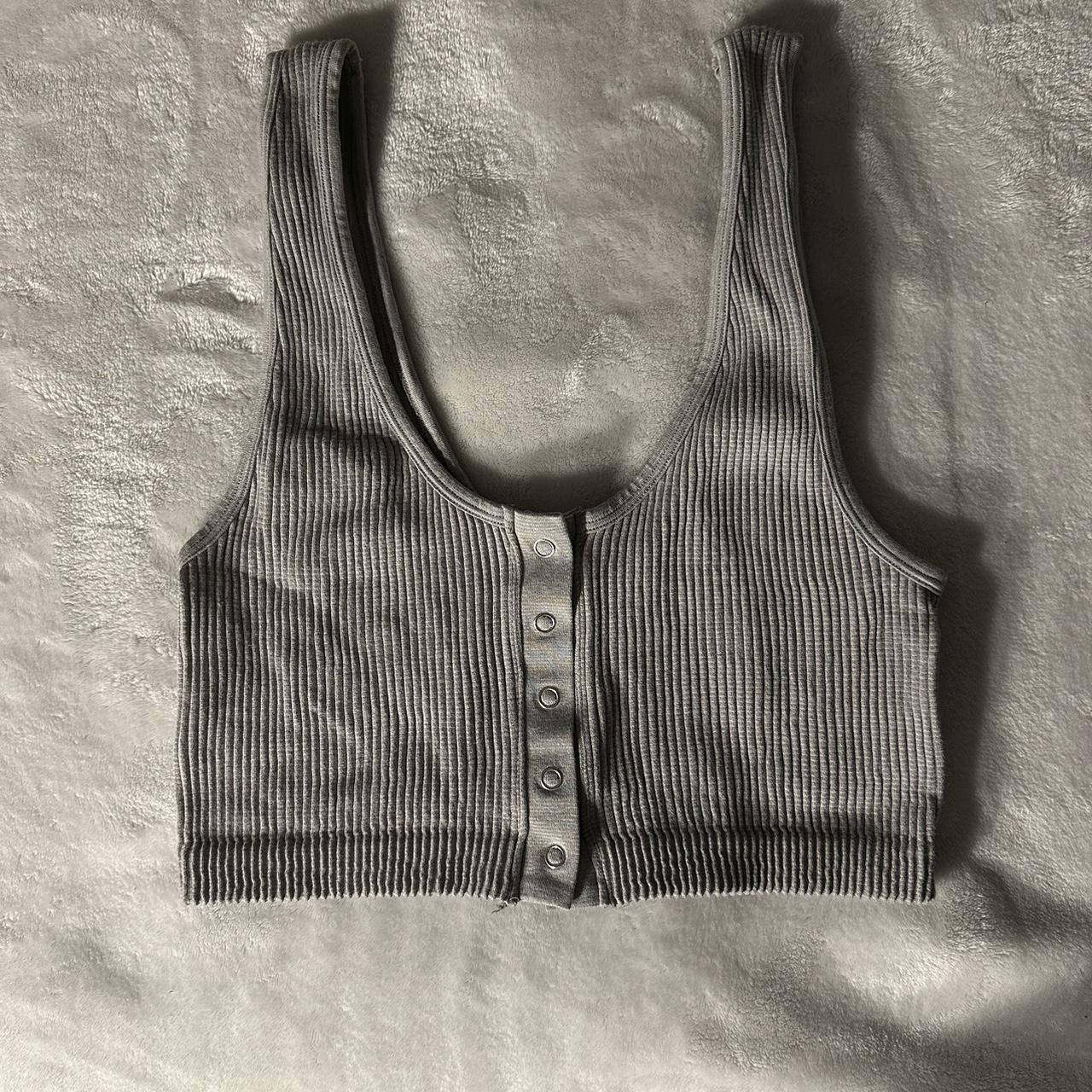 ribbed gray tank top, its pretty low cut but a good... - Depop