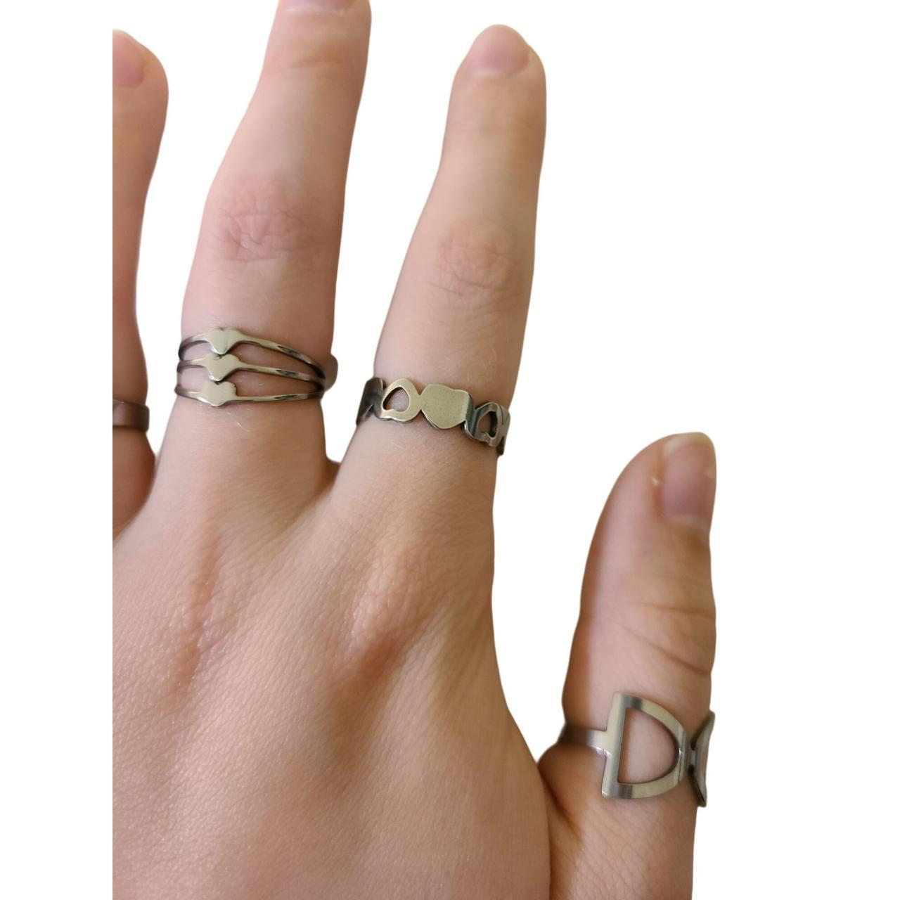Five stainless steel rings set. Ring size from left... - Depop