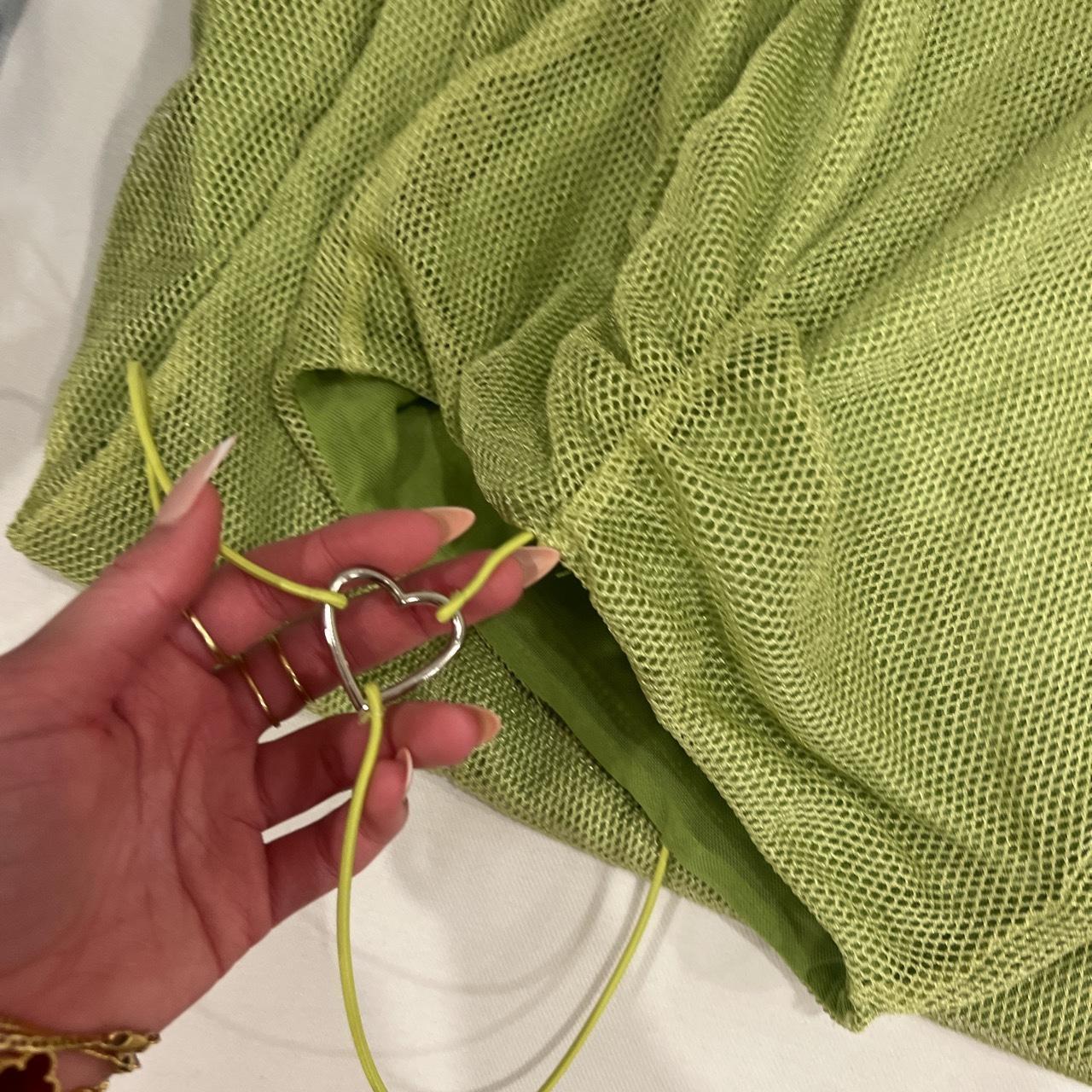 Tiger Mist green warp set with metal heart accents... - Depop