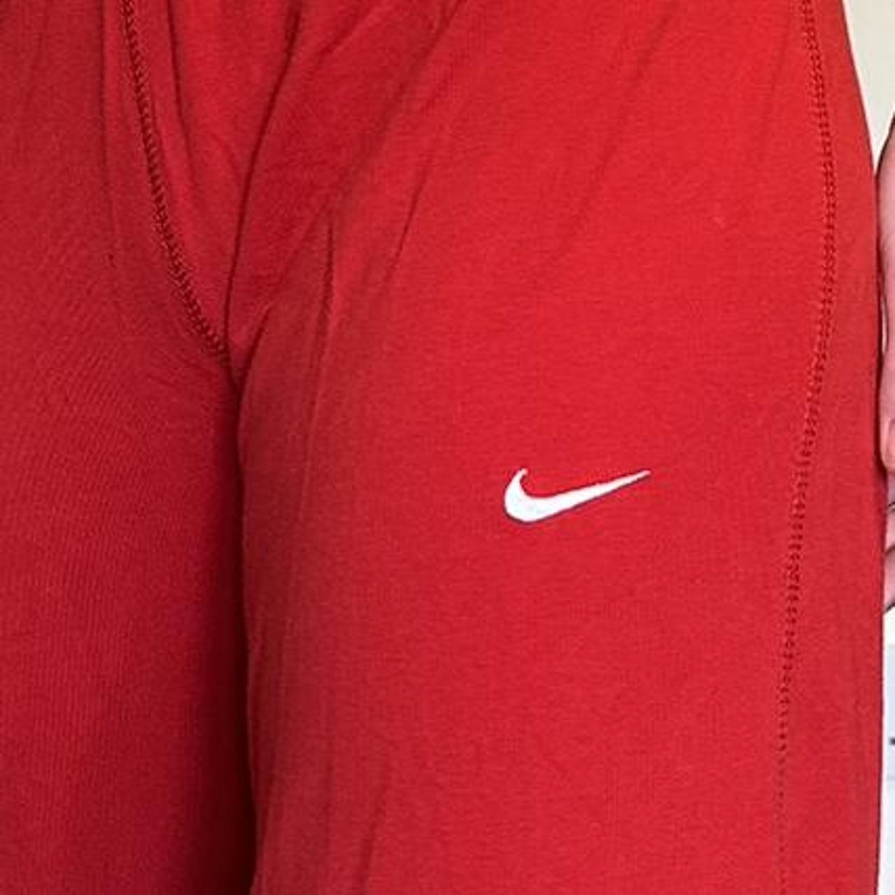 Red Nike tracksuit bottoms Low waisted Super... - Depop