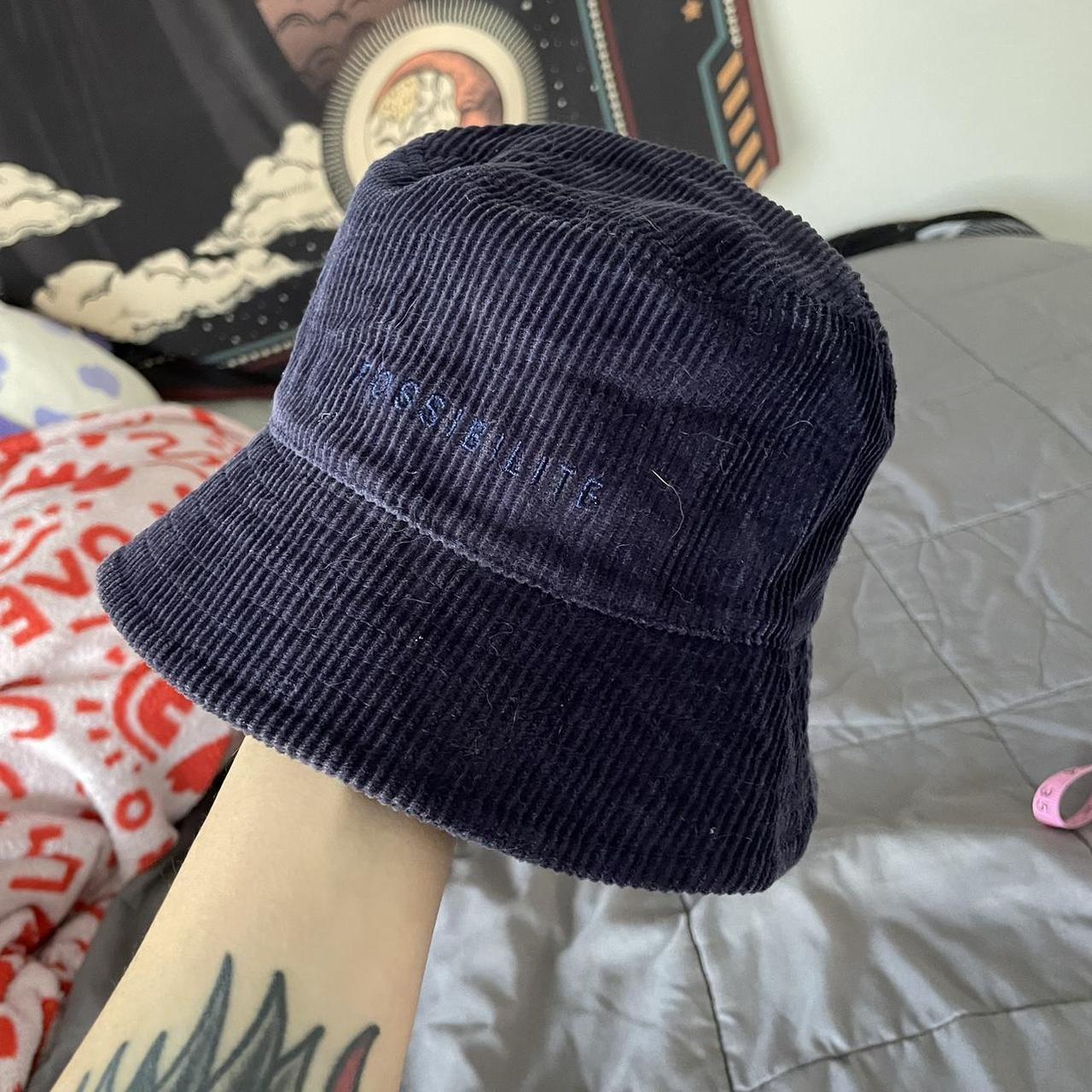 navy h&m bucket hat reads “possibilitè” in dark... - Depop