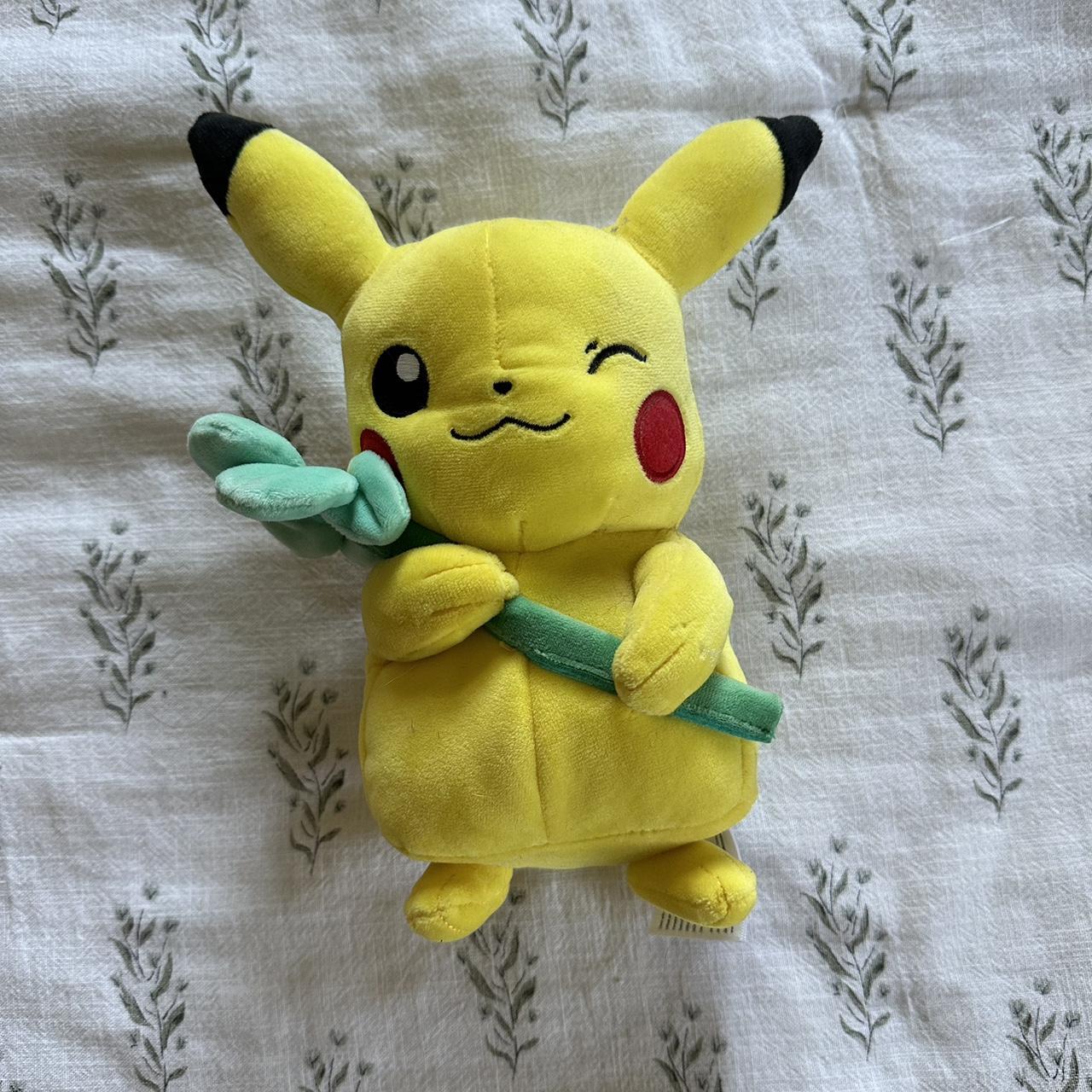 Plush Pikachu holding a flower - Depop