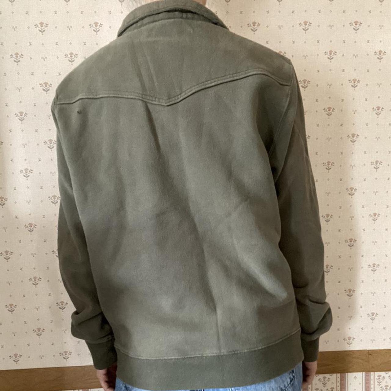 Green zip up jacket. No hood and high neck that can... - Depop