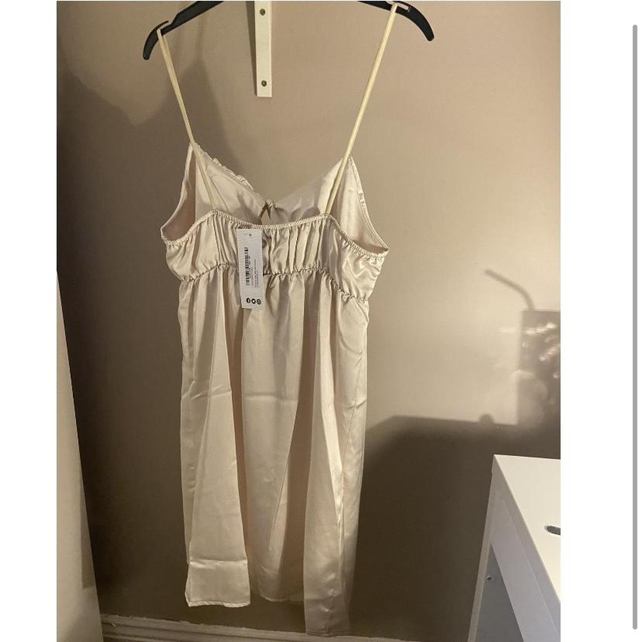 Cream / champagne colour satin dress. Stretchy back... - Depop