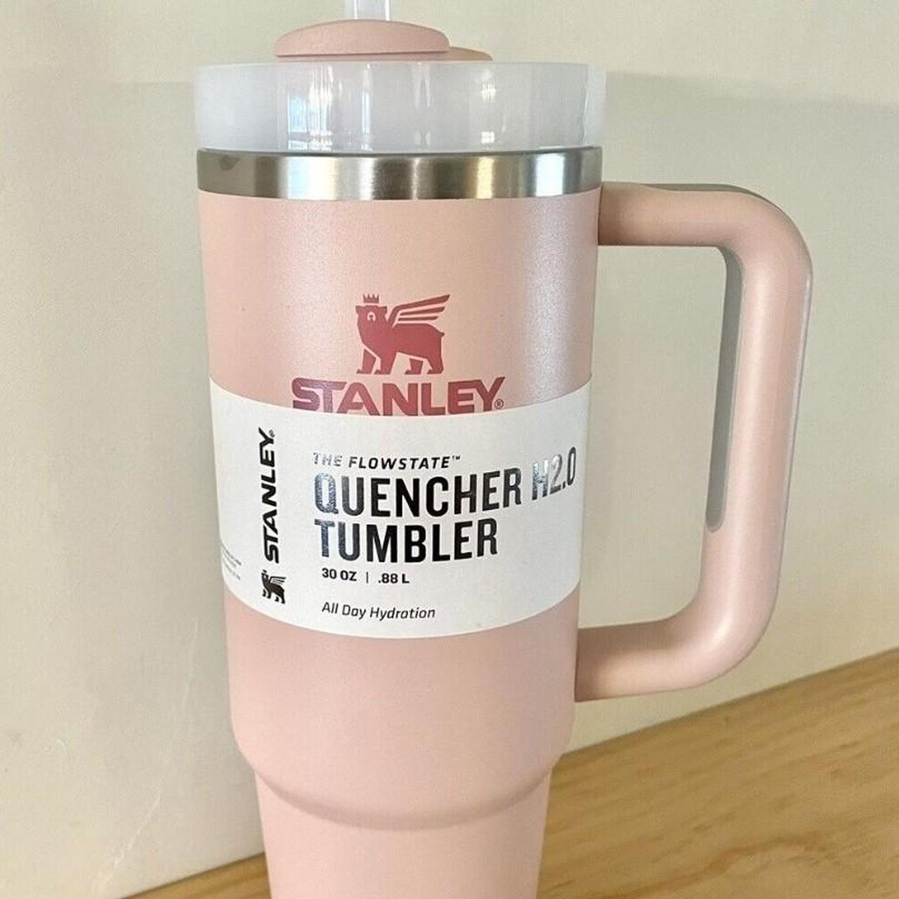 The light pink Stanley 40oz Quencher tumbler is the... - Depop
