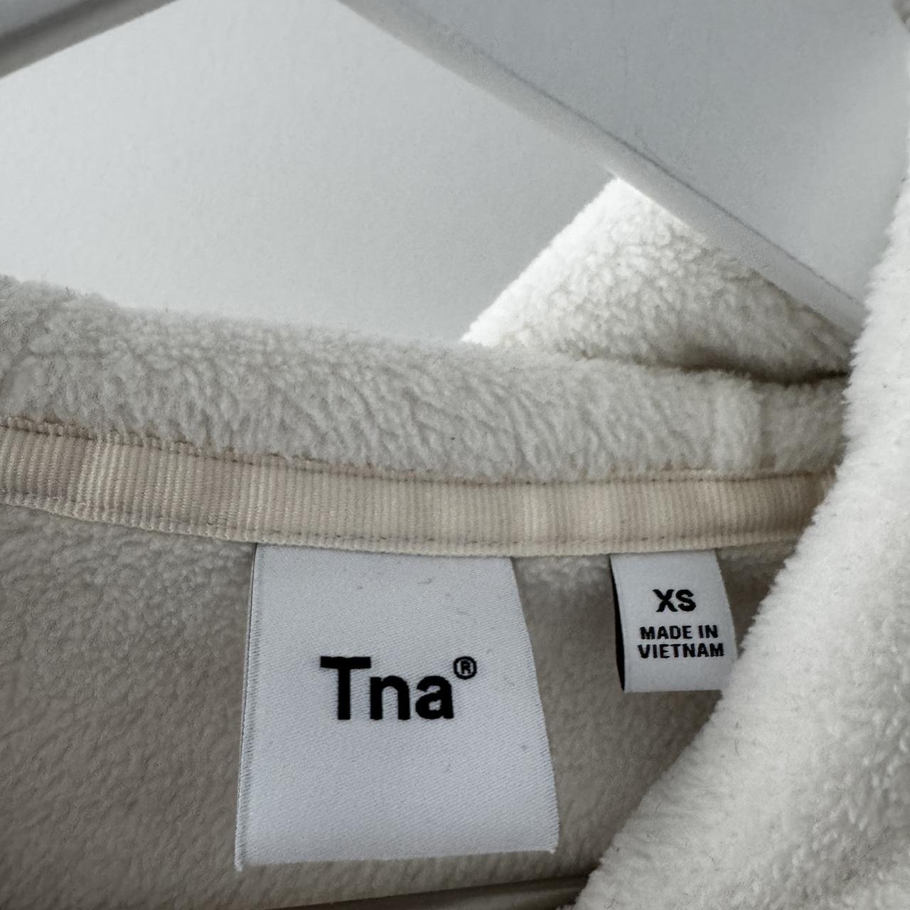 cream tna fleece zip up xs has lip a small stain on... | Depop