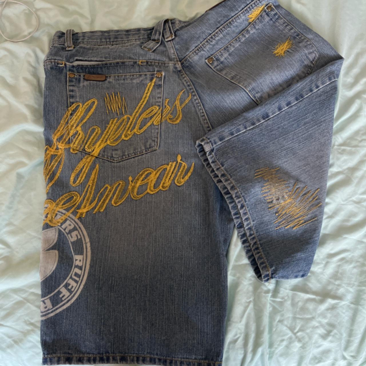 Jorts/ jean shorts Blue jeans with yellow design on... - Depop