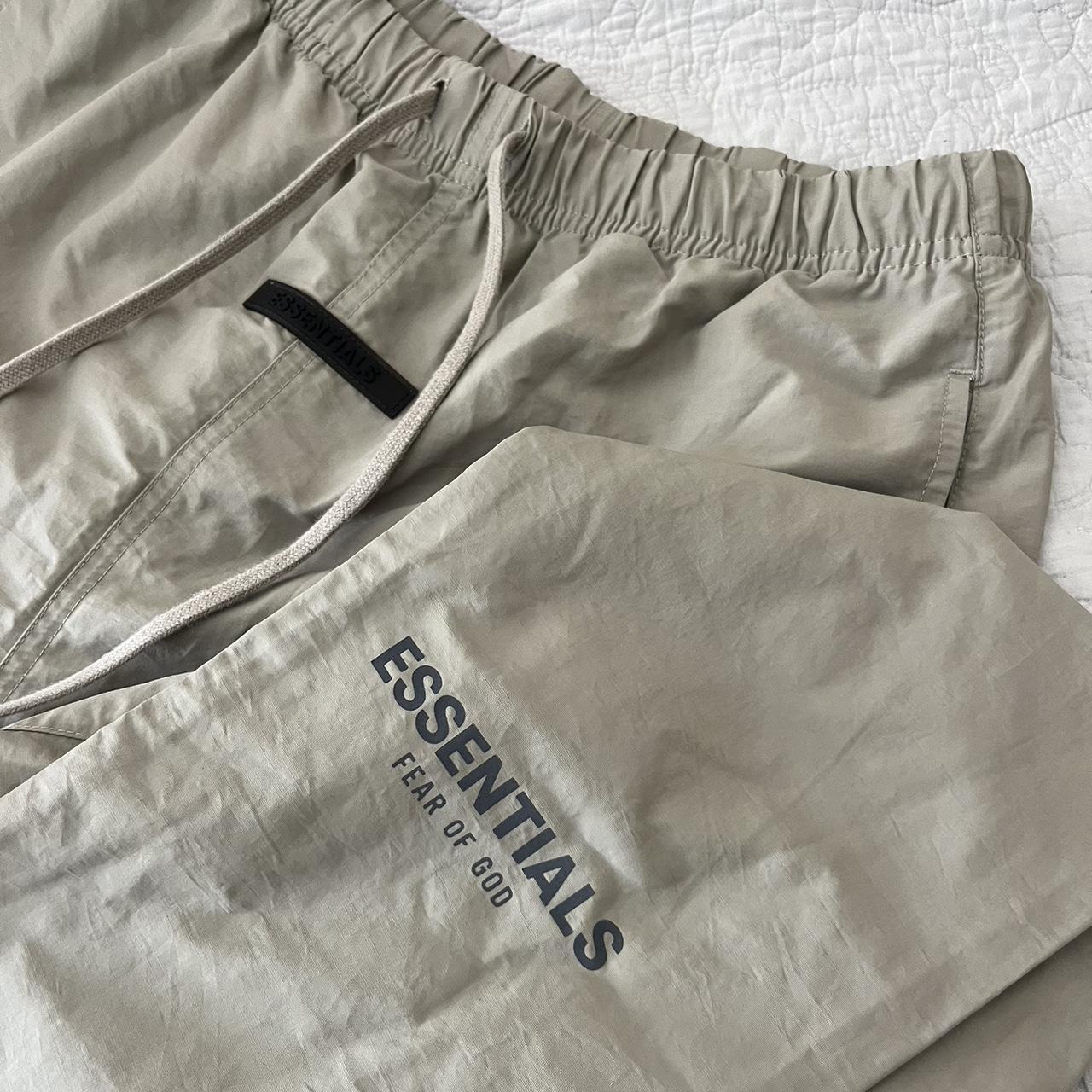 Essentials Nylon Track pants with drawstring... - Depop