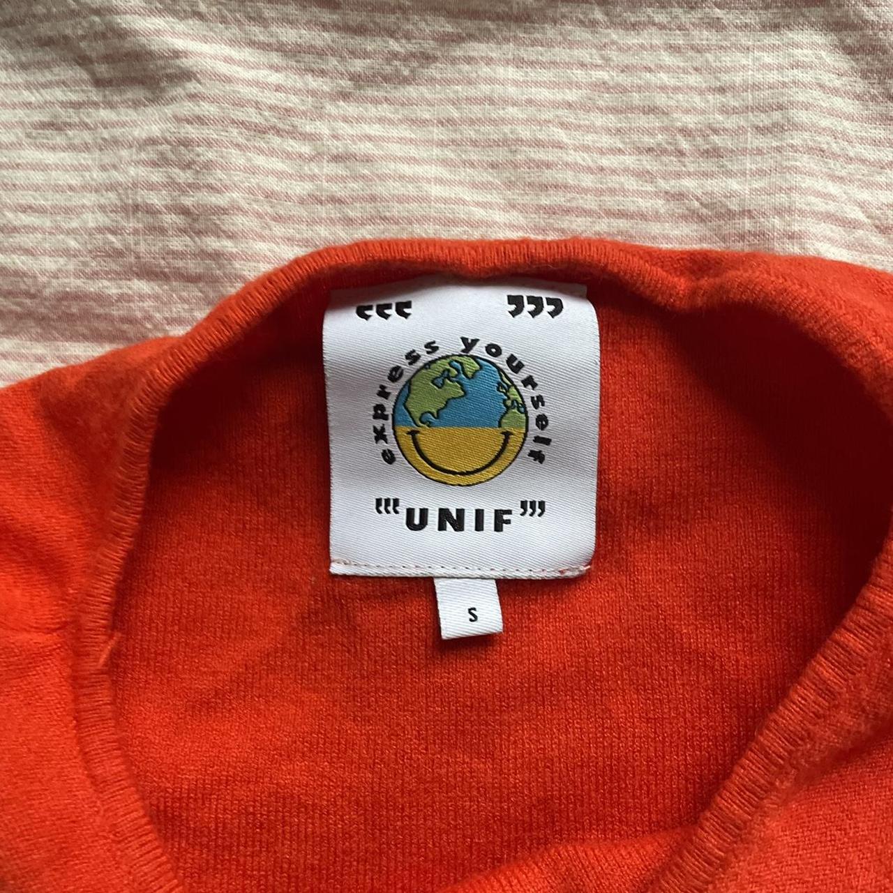 unif orange bear top. seam has ripped around the... - Depop