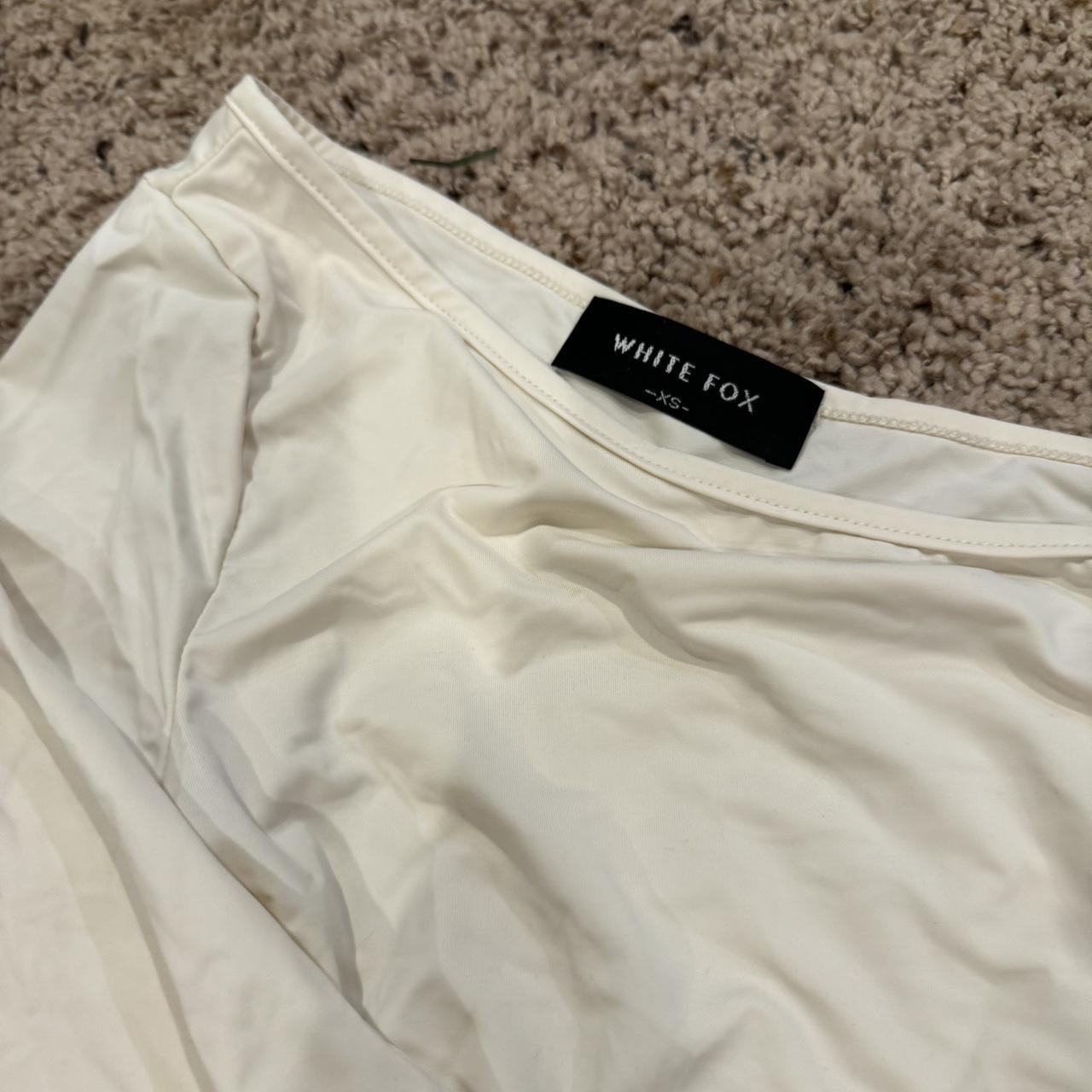 Slanted off shoulder white fox top never worn - Depop
