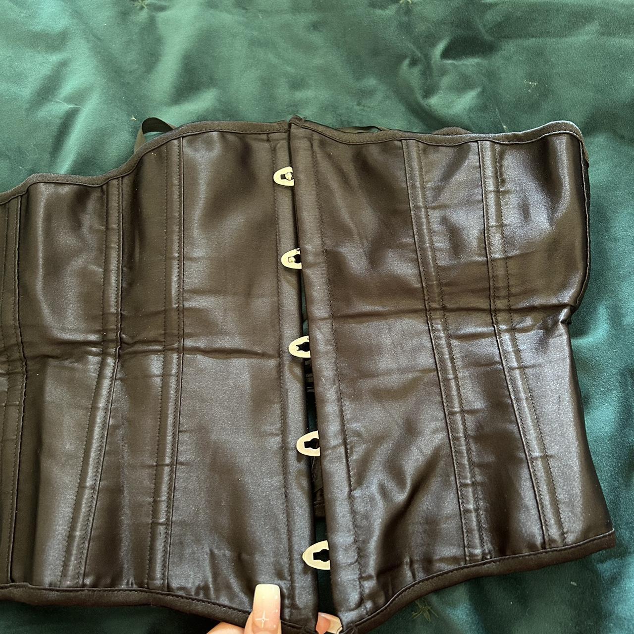 Small black corset. Makes me look super snatched... - Depop