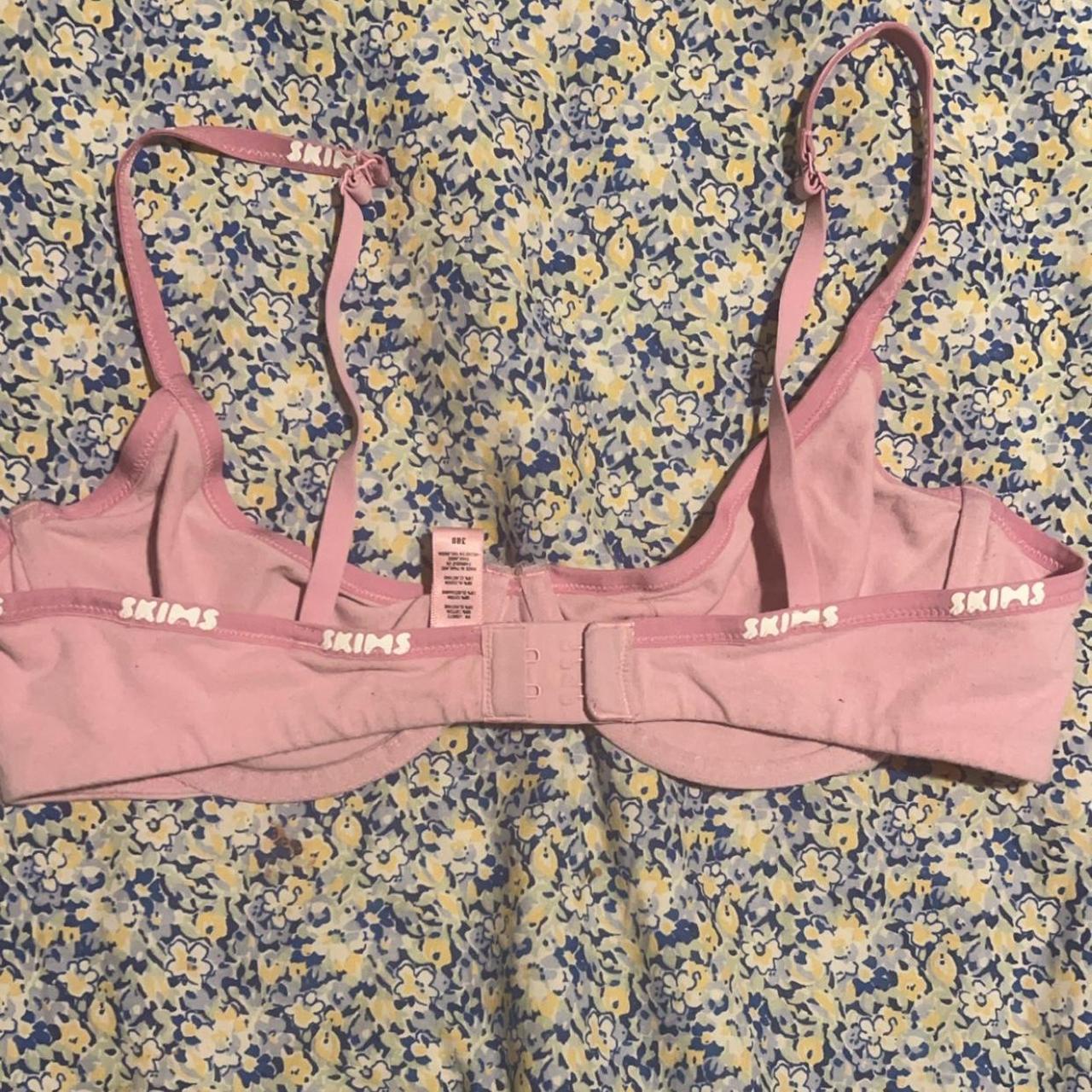 Pink Skims bra 38b a little worn - Depop