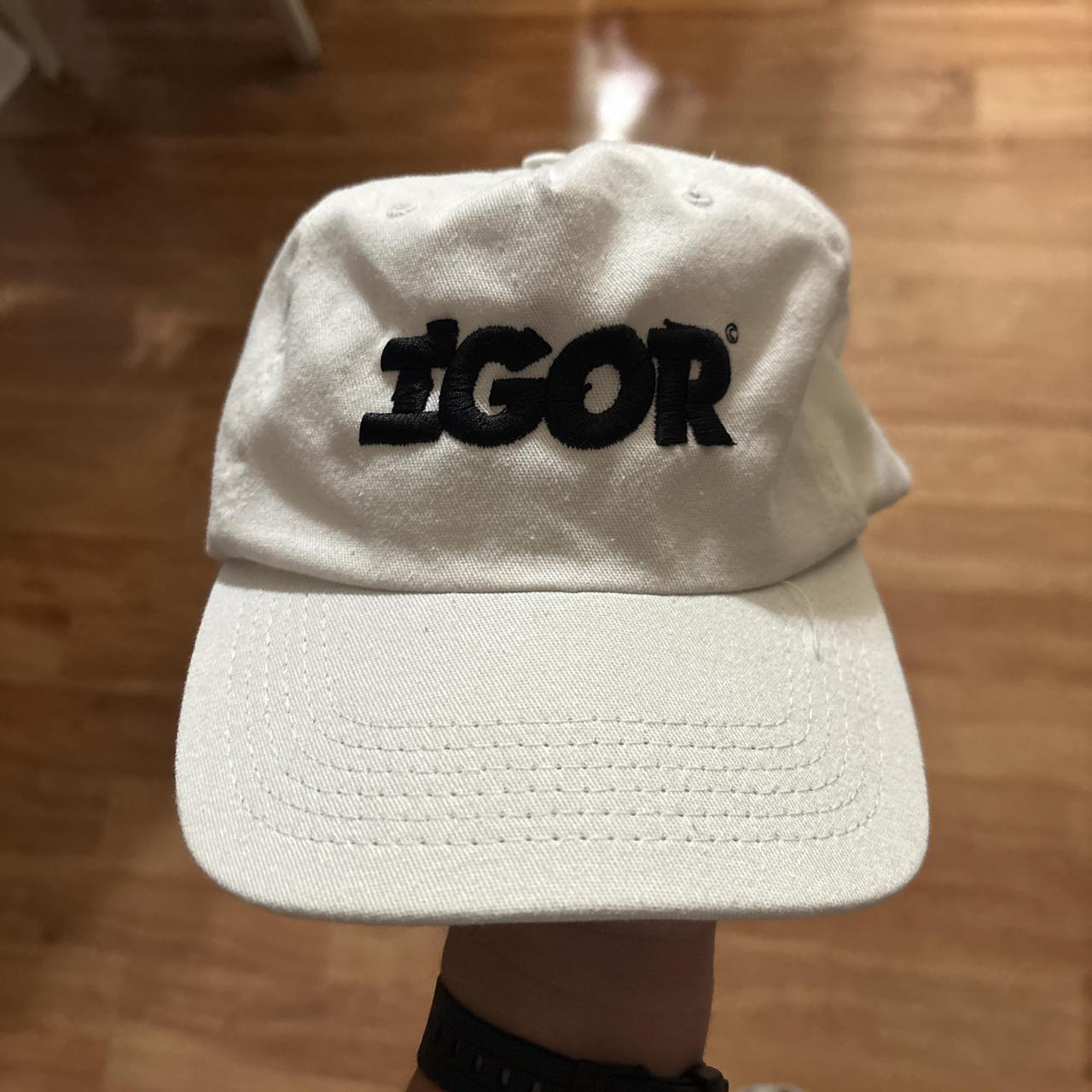 White and black Igor hat, yellowing on the... | Depop