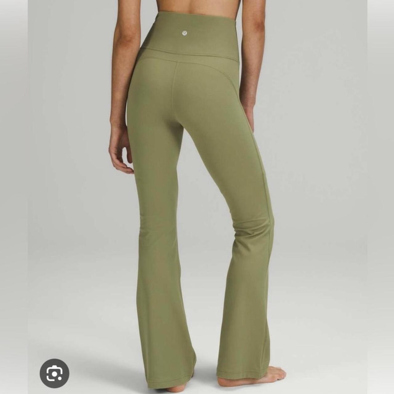 Lululemon Green Flare Leggings Size 4 Small stain... - Depop