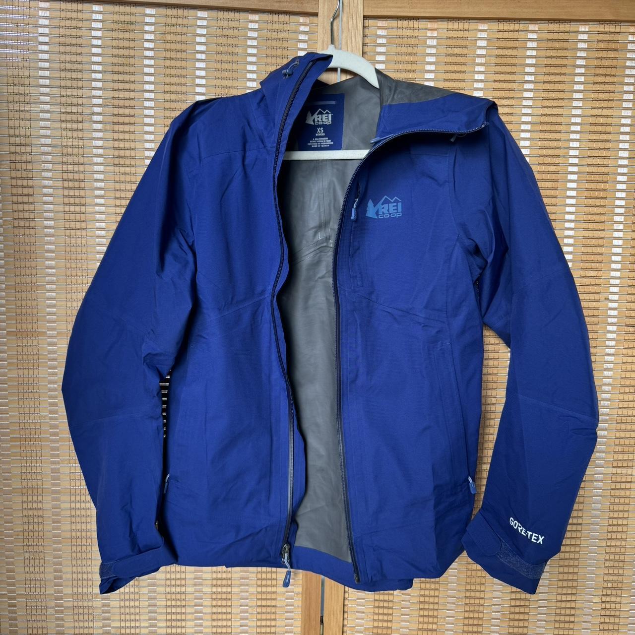 REI blue rain jacket Never worn! open to offers... - Depop